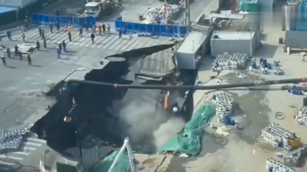 On Camera, Massive Sinkhole Swallows Vehicles, Road In China's Shanghai ...
